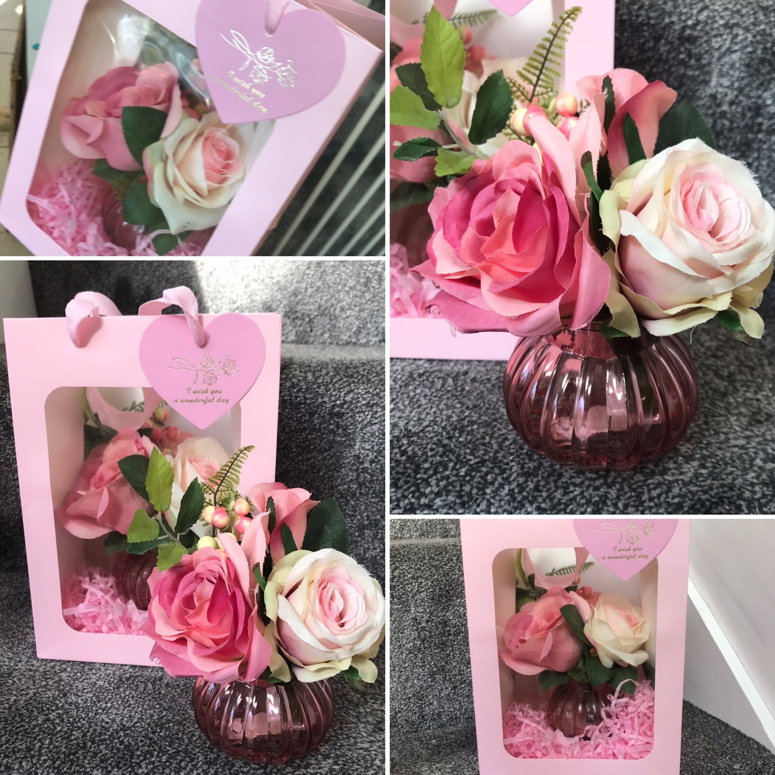 A small posy arrangement of pink silk roses in presention giftbag ...